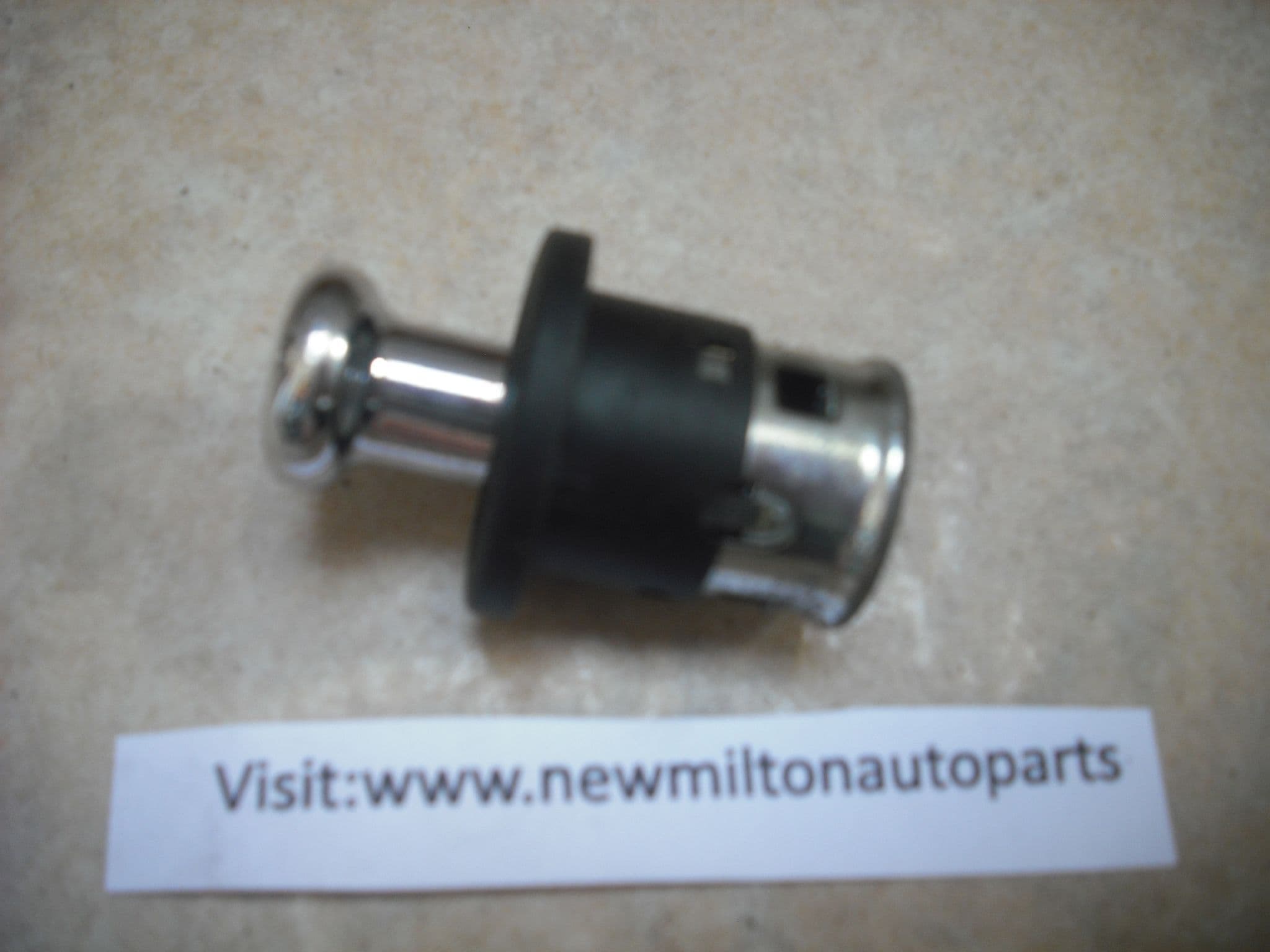 A GENUINE JAGUAR S TYPE VANDEN PLAS CIGARETTE LIGHTER INSERT