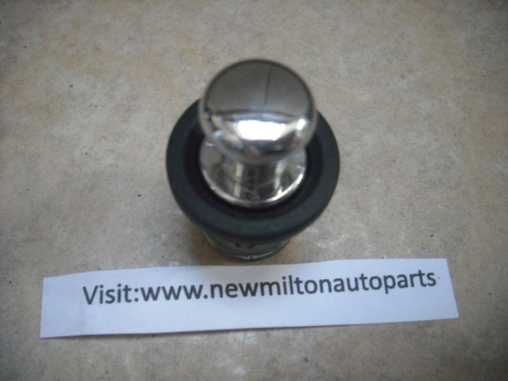 A GENUINE JAGUAR S TYPE VANDEN PLAS CIGARETTE LIGHTER INSERT