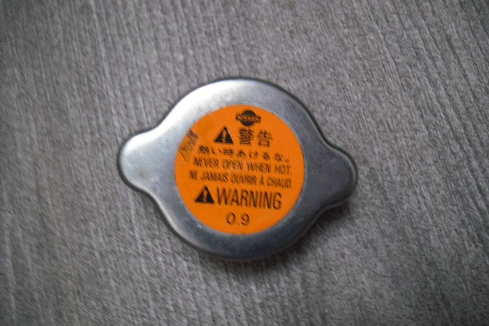A GENUINE NISSAN NOTE 0 9 BAR RADIATOR CAP