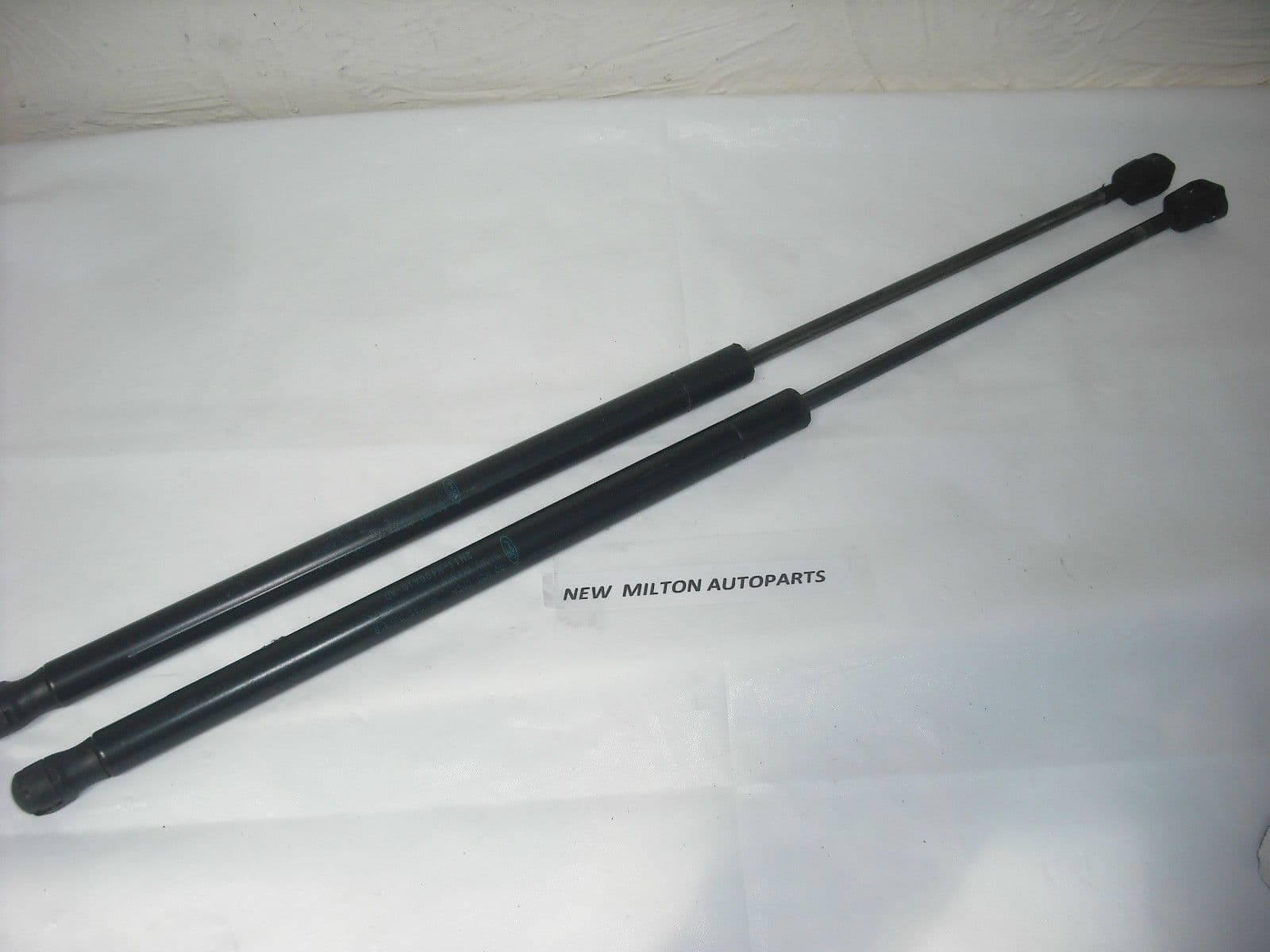 SOLD A PAIR OF GENUINE FORD FUSION TAILGATE GAS LIFT STRUTS