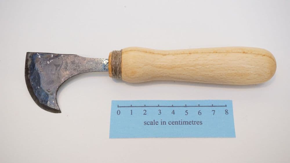 late medieval half lunulate leather cutter with beech handle and linen ...