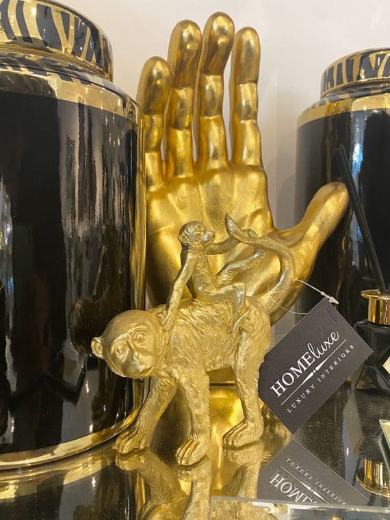 Gold Monkeys With Figurine