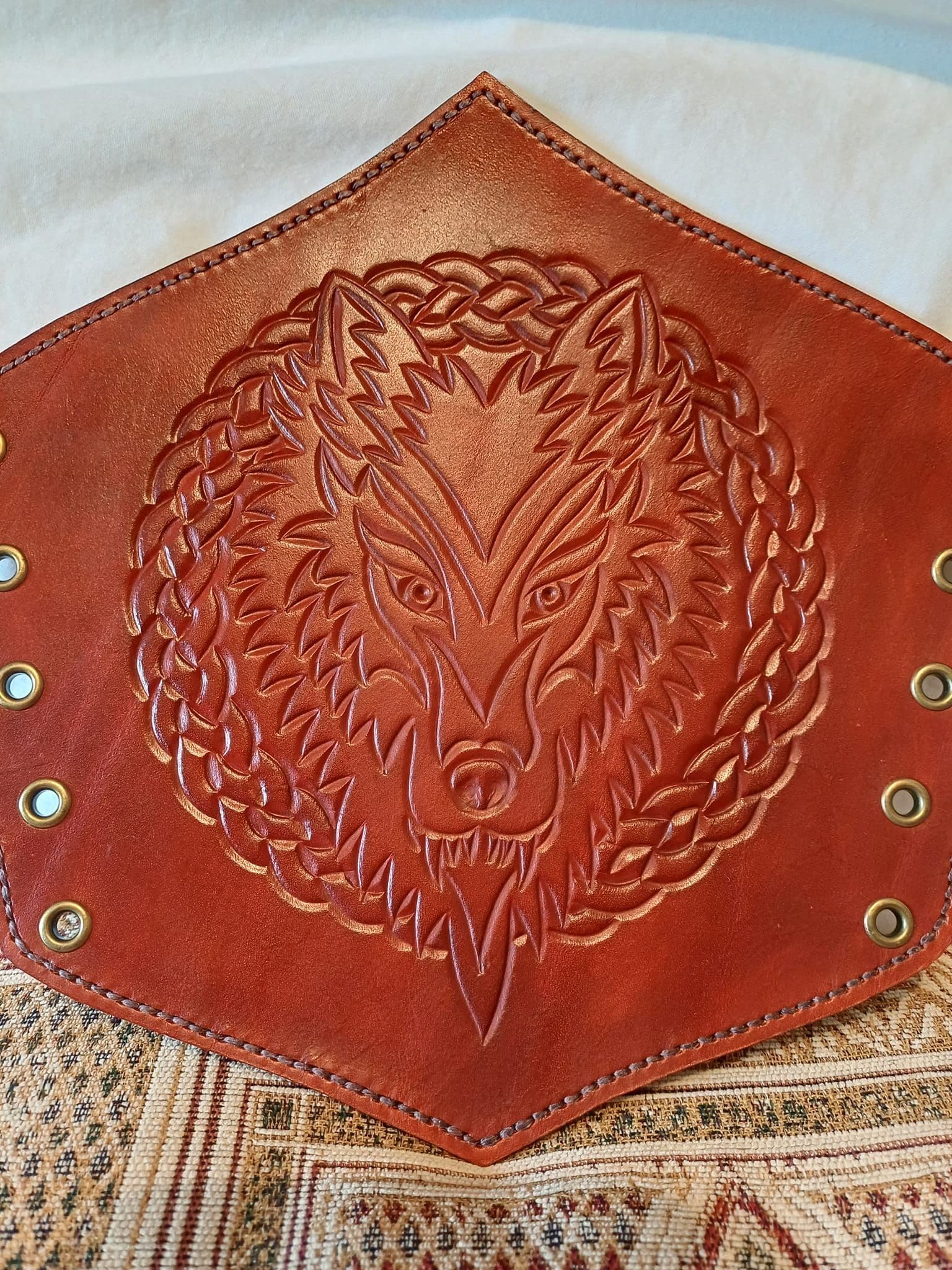 Leather arm bracer gauntlet embossed with Wolf head within a circular ...