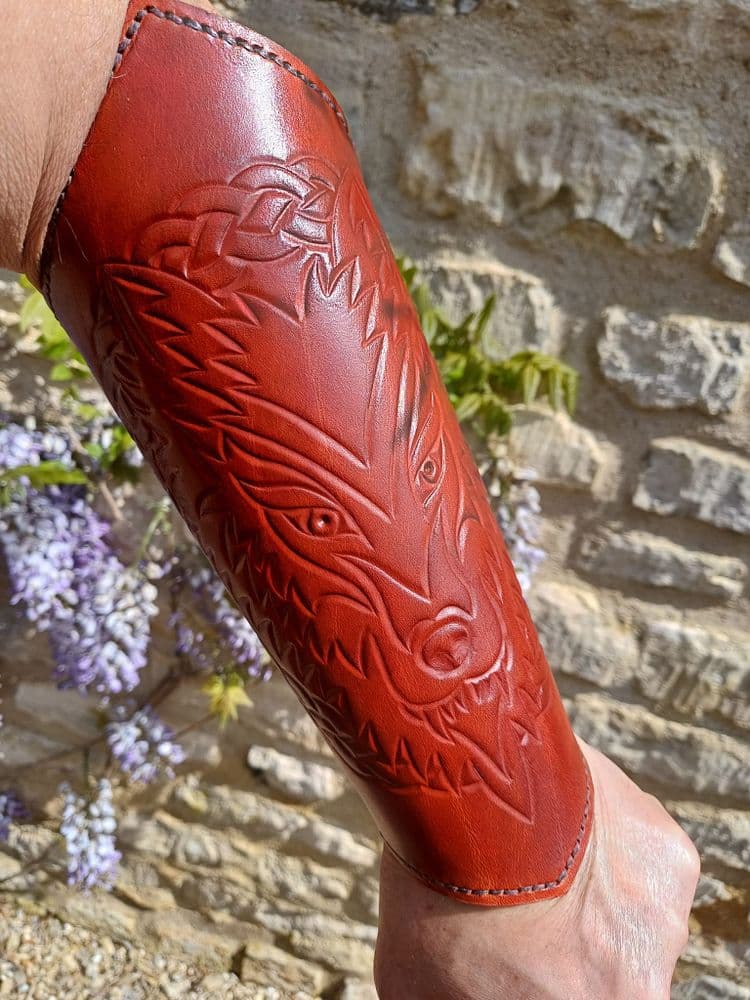 Leather arm bracer gauntlet embossed with Wolf head within a circular ...