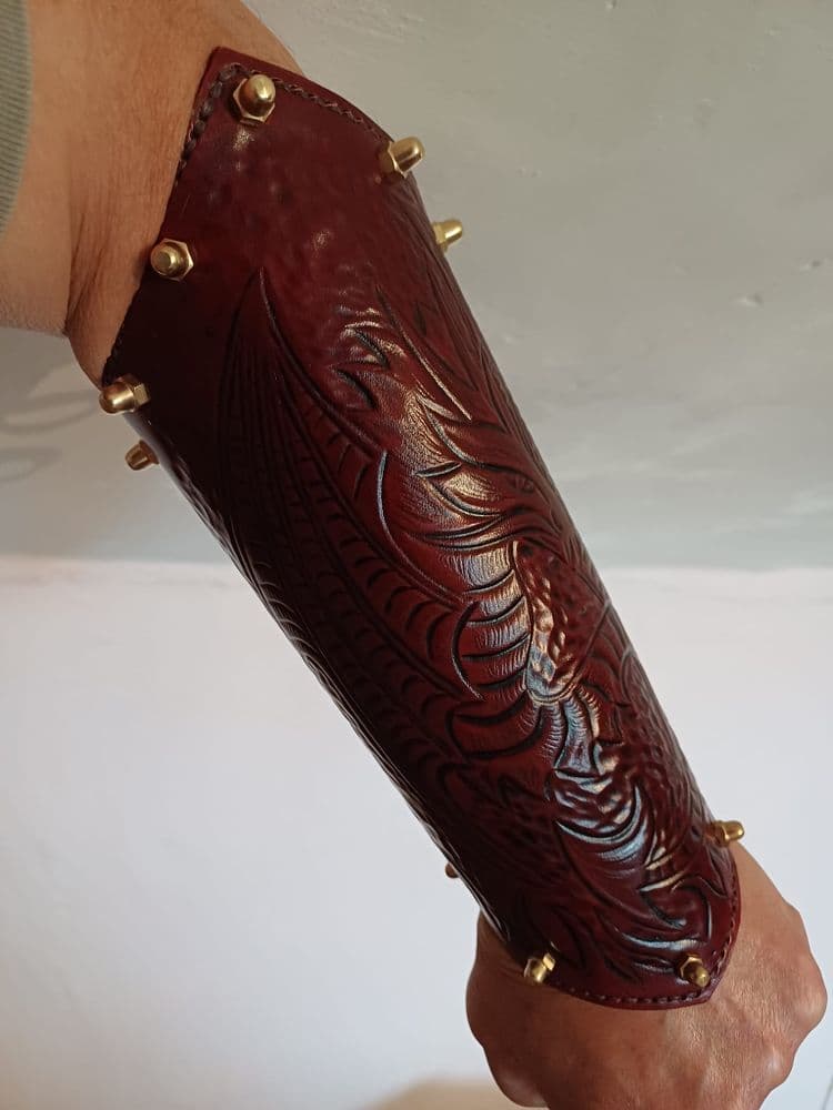 Leather arm bracer withembossed Dragon and solid brass studs