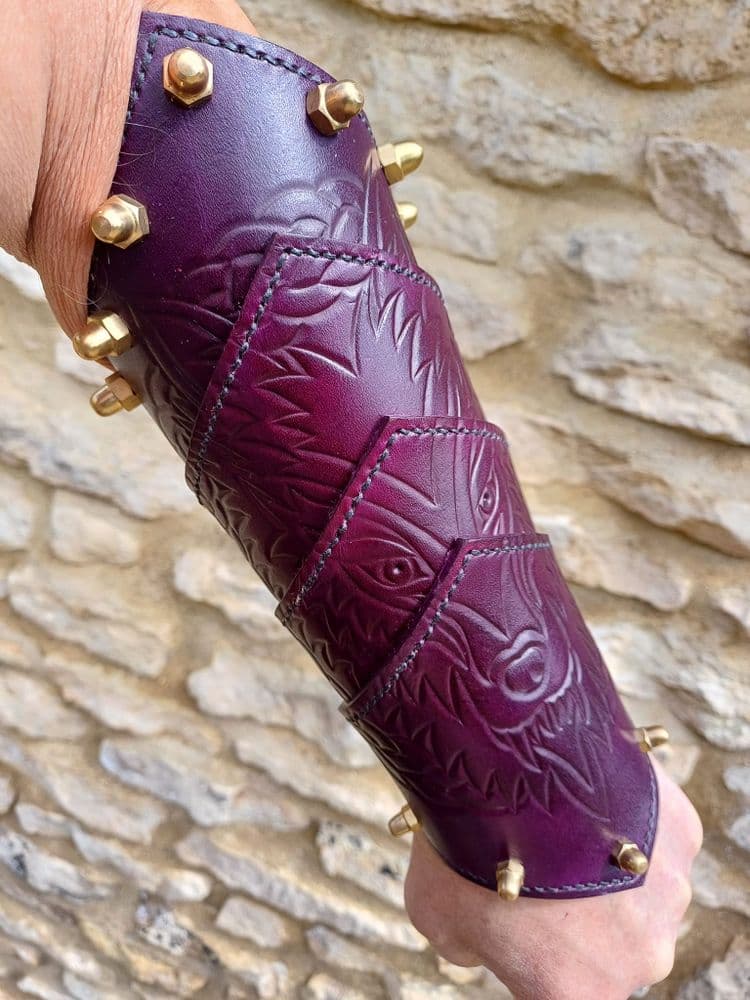 Segmented leather arm bracer with Wolf head embossing in a Celtic knot ...