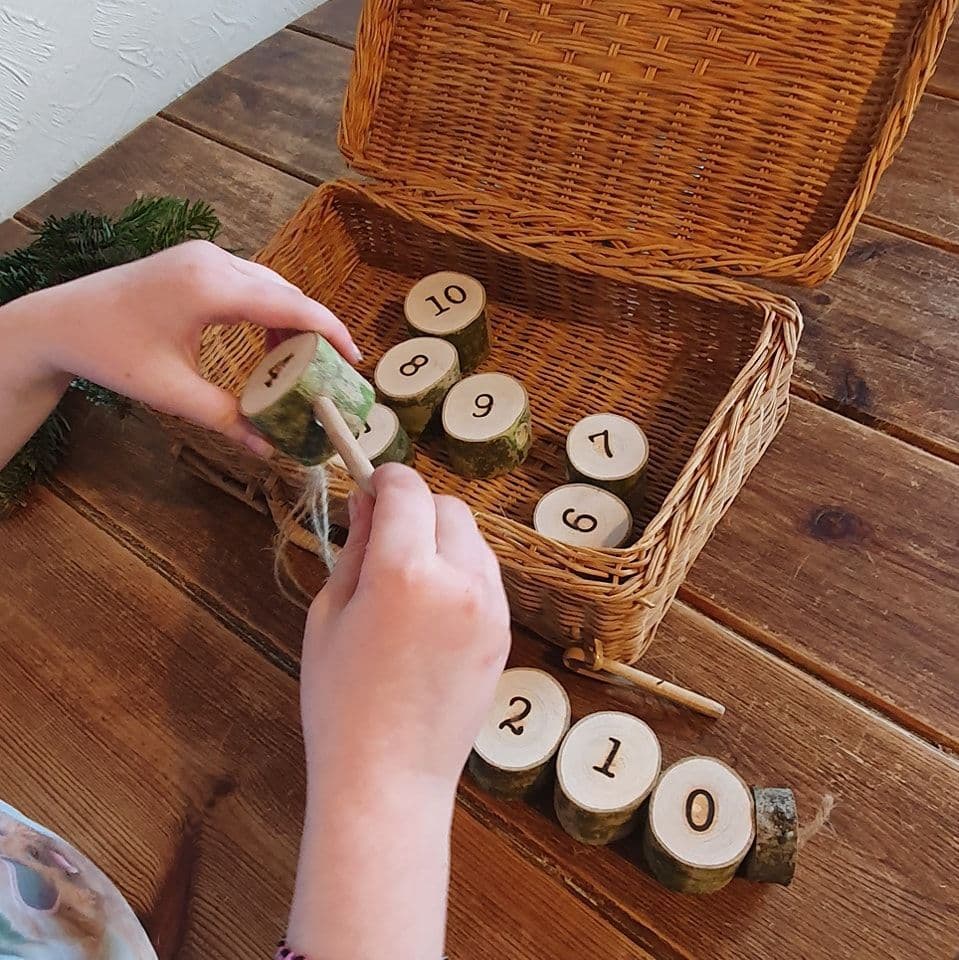 Woodburned Numbers Threading with Needle