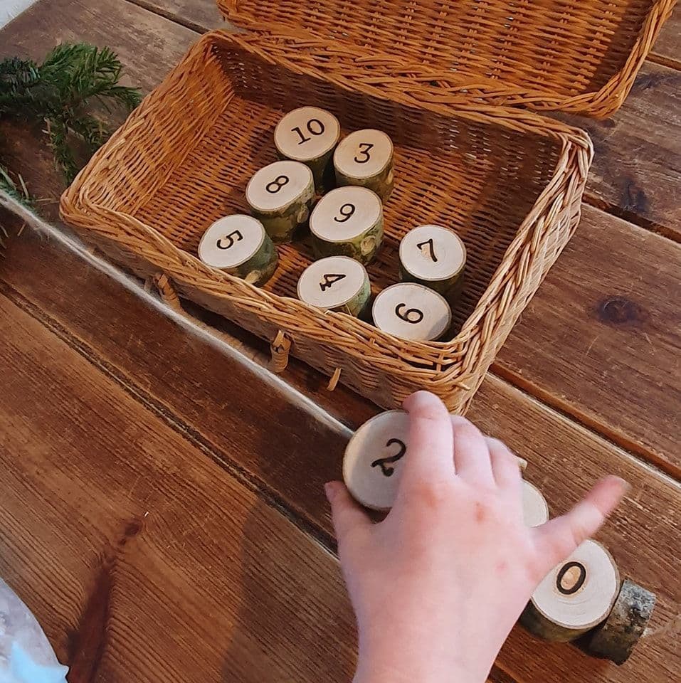 Woodburned Numbers Threading with Needle