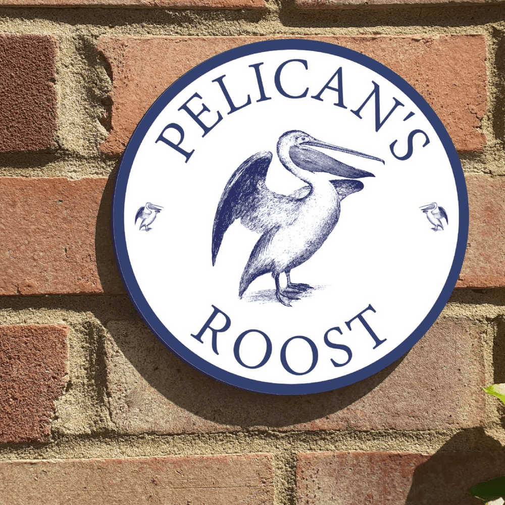 Pelican round house or beach hut sign
