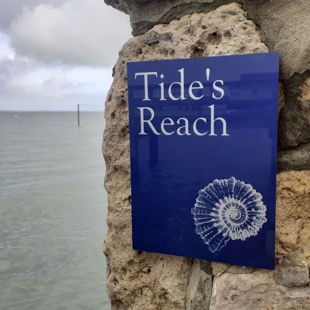 Triton shell house sign on navy