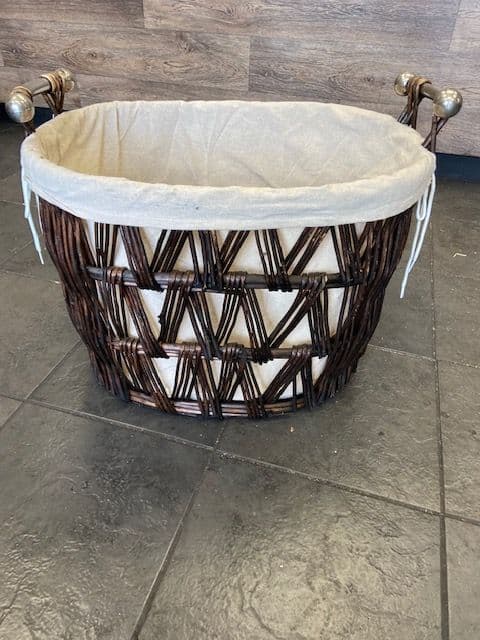 Large oval dark brown finish basket with removeable liner