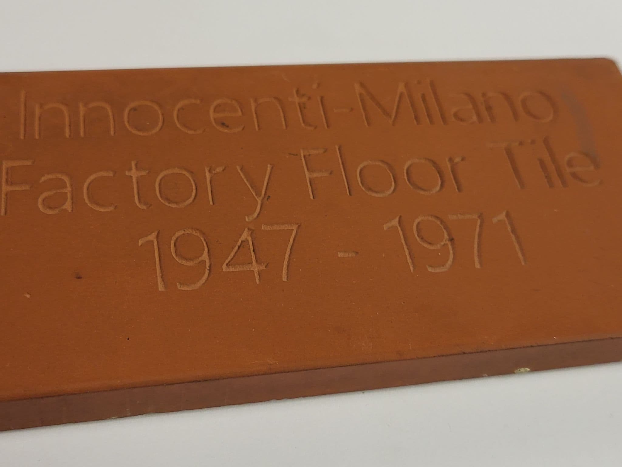 Lambretta innocenti factory floor tile with script