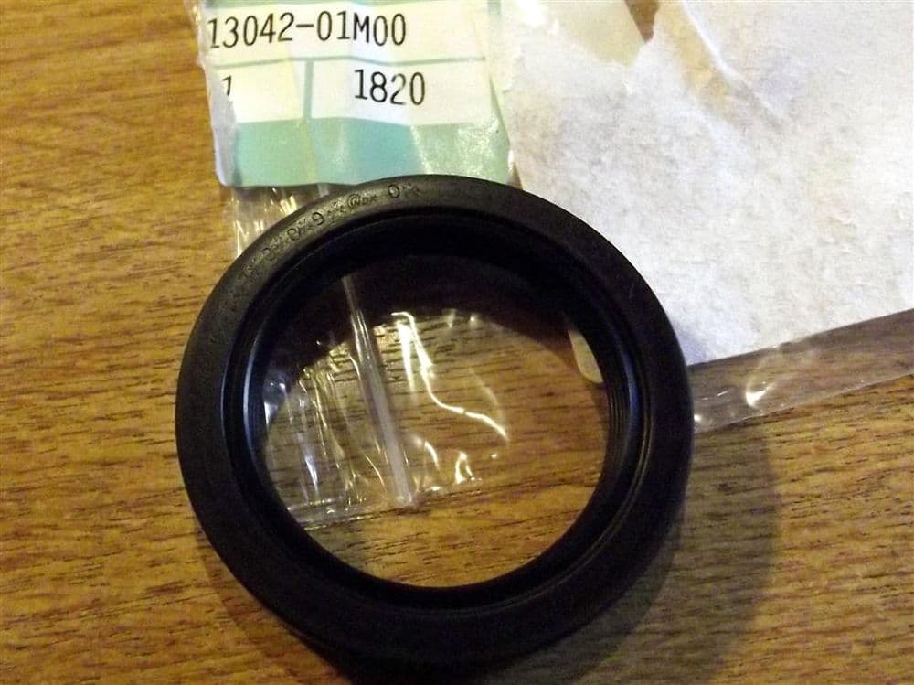 Oil seal camshaft genuine Nissan S-Cargo 13042-01M00