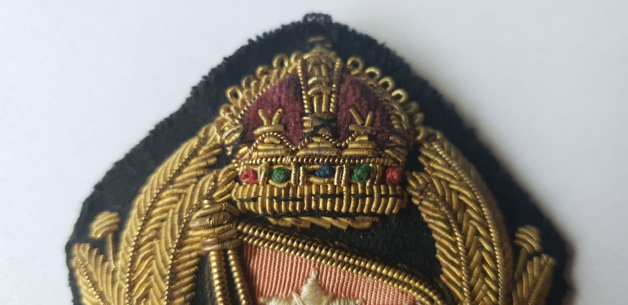 genuine/original white star line officers cap badge