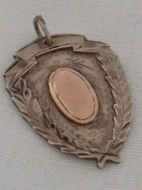 A Silver and Rose Gold Sporting Shield Fob - Hallmarked Birmingham 1921