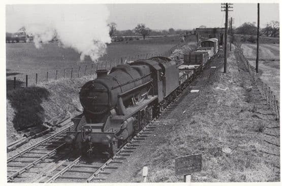 Black Eight 48698 Train Passing Mobberley Station in 1951 Railway Postcard