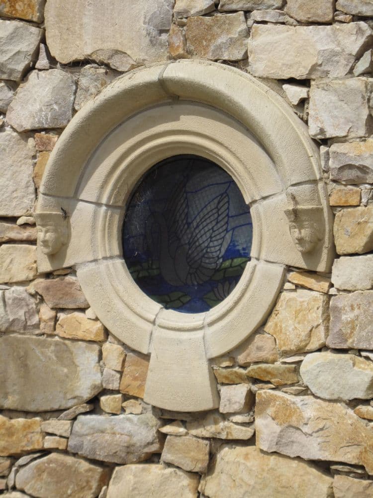 Gothic round hooded window