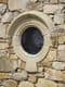 Gothic round hooded window