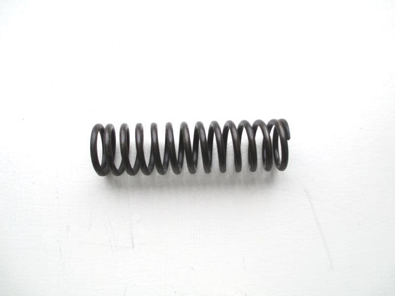 Spring for parking brake caliper arms