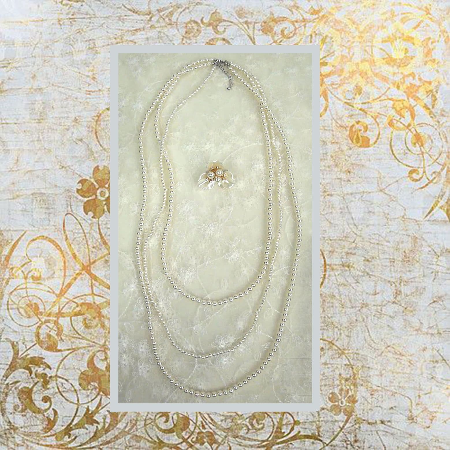 J010078 Three strings of pearls with removable triple bow pearl brouche