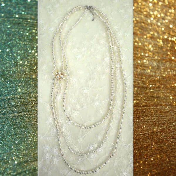 J010078 Three strings of pearls with removable triple bow pearl brouche