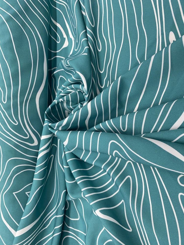LINES Turquoise and White Curved Lines Viscose Dressmaking Fabric