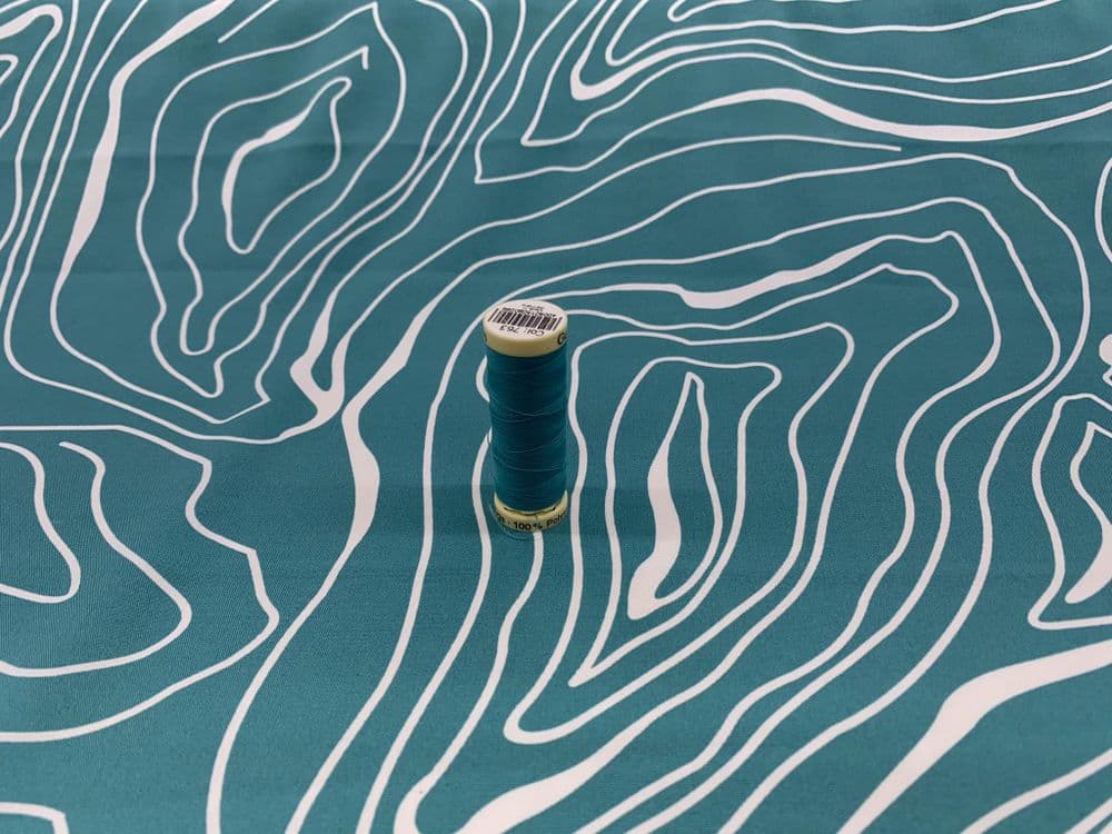 LINES Turquoise and White Curved Lines Viscose Dressmaking Fabric