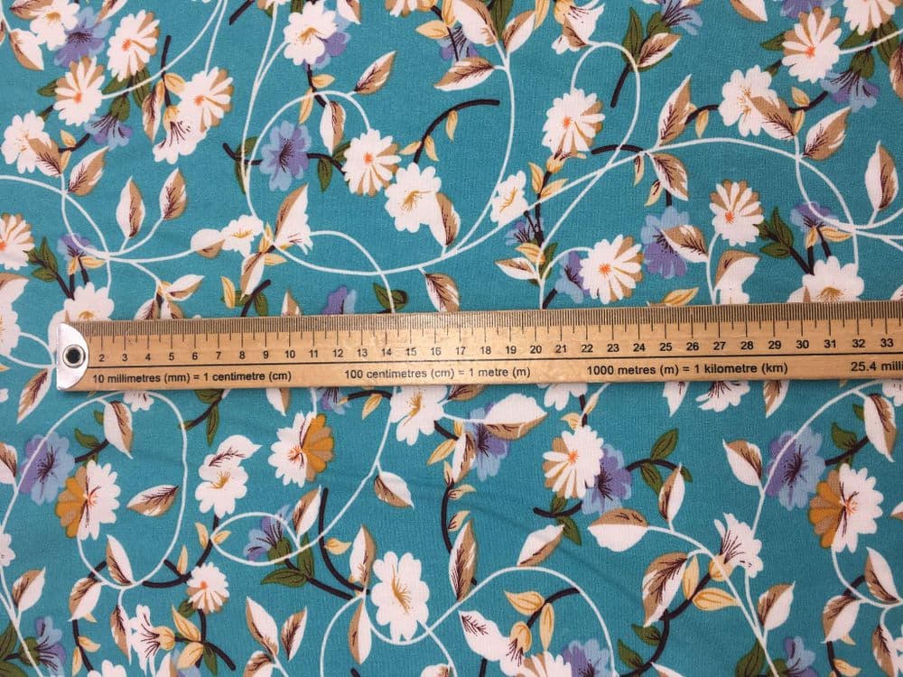 Viscose Dress Fabric - Delicate White & Lilac Flowers on Turquoise