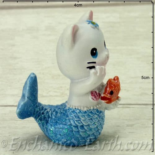 Mermaid Cat - Tuna in Blue holding a toy fish - 4.5cm tall.