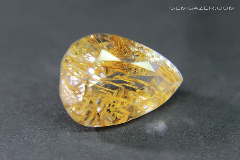 Colourless Topaz with golden yellow Limonite inclusions faceted ...