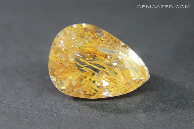 Colourless Topaz with golden yellow Limonite inclusions faceted ...