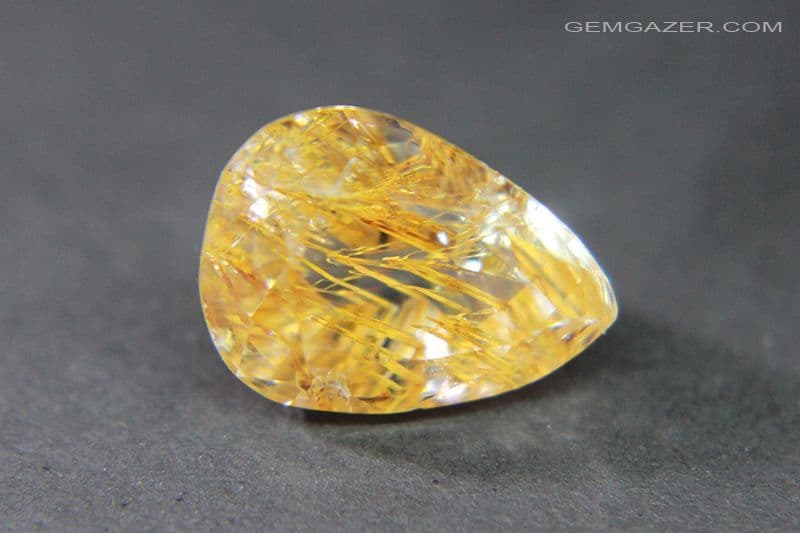 Colourless Topaz with golden yellow Limonite inclusions faceted ...