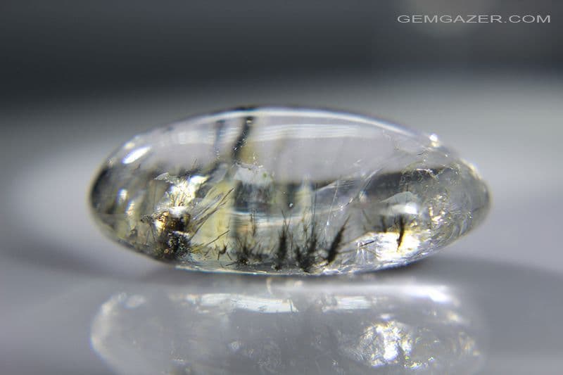 Quartz cabochon with radial green Actinolite inclusions China 31 99 carats