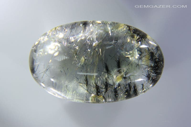 Quartz cabochon with radial green Actinolite inclusions China 31 99 carats