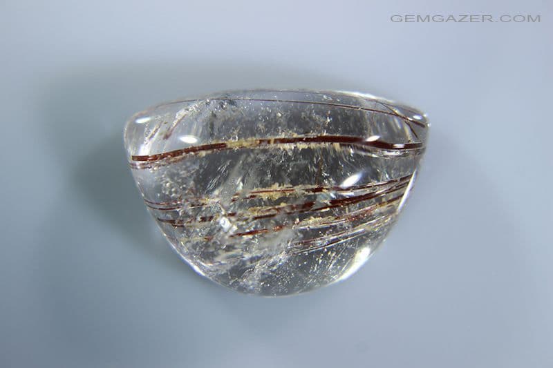 Quartz cabochon with red Rutile needle inclusions Brazil 16 42 carats