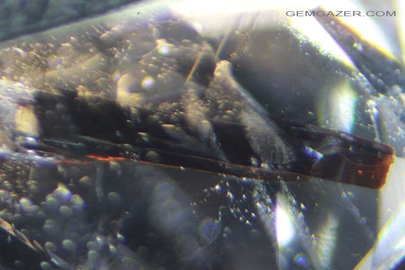 Topaz with Biotite Mica inclusions faceted Pakistan 3 05 carats