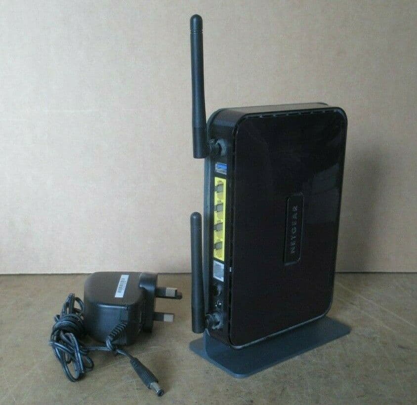 NETGEAR 300 Mbps 10/100 Wireless N 4 Port Modem Router DGN2200M With Stand