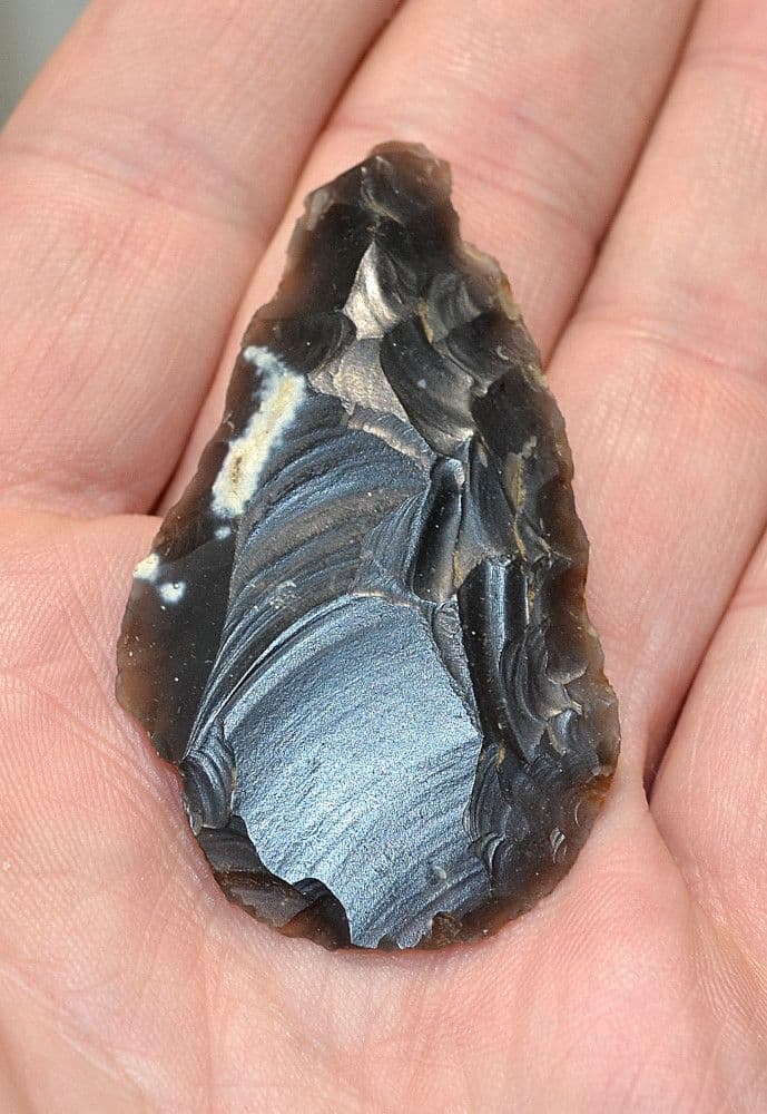 A compact finely worked and excellent Neolithic flint spear head ...