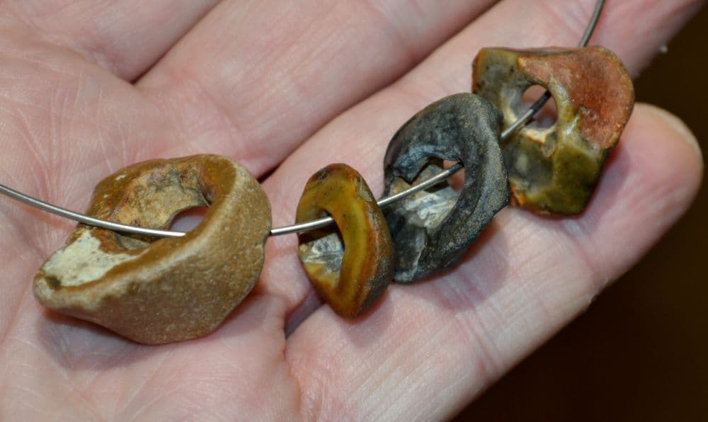 A group of 4 x Mesolithic "Hag Stone" flint beads North Cambridgeshire ...