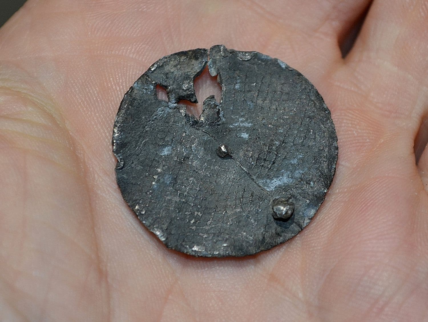 A rare late Anglo Saxon / Viking lead-pewter disc brooch featuring a ...