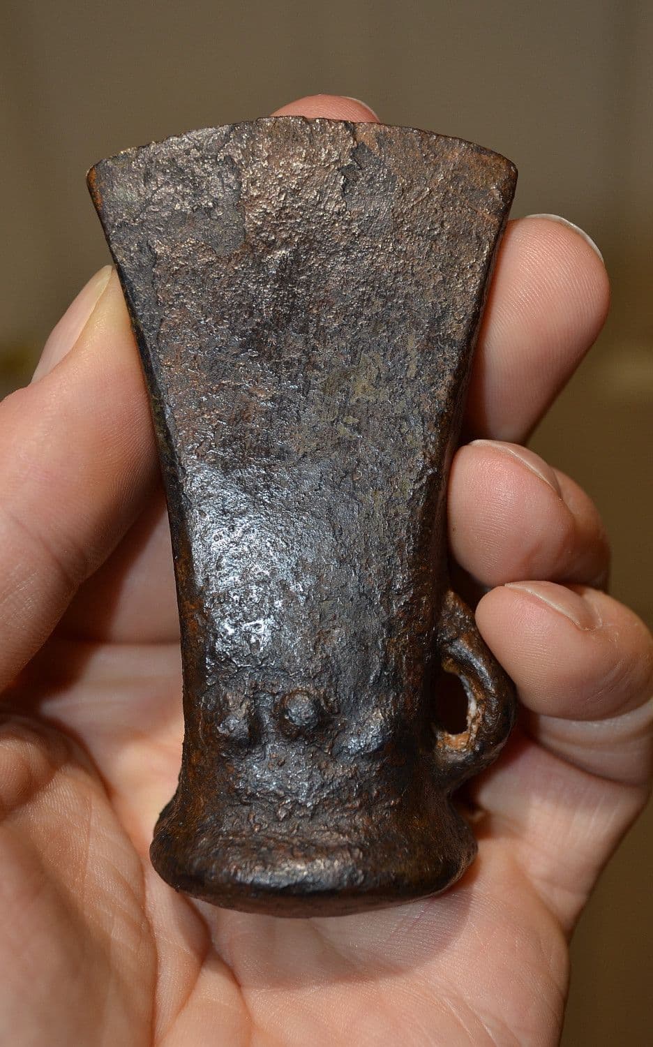 A rare Late Bronze age bronze socketed axe head with embossed pellet ...