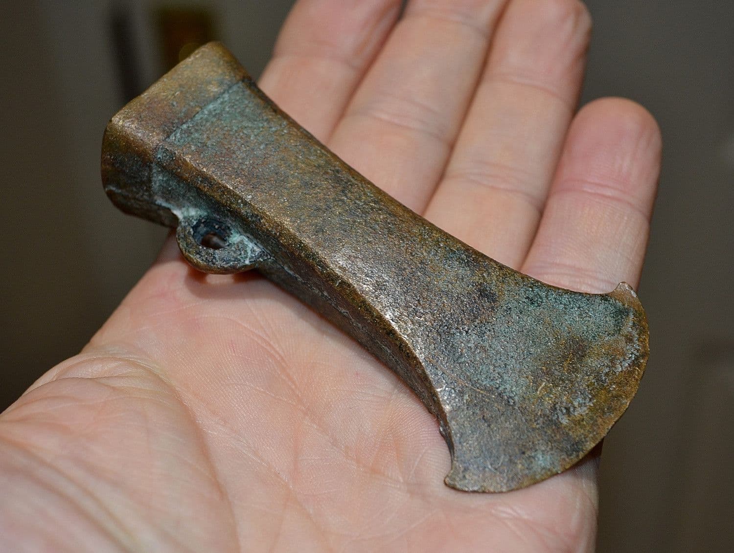 An excellent and scarce form of Mid-Late Bronze age bronze side looped socketed axe head found ...