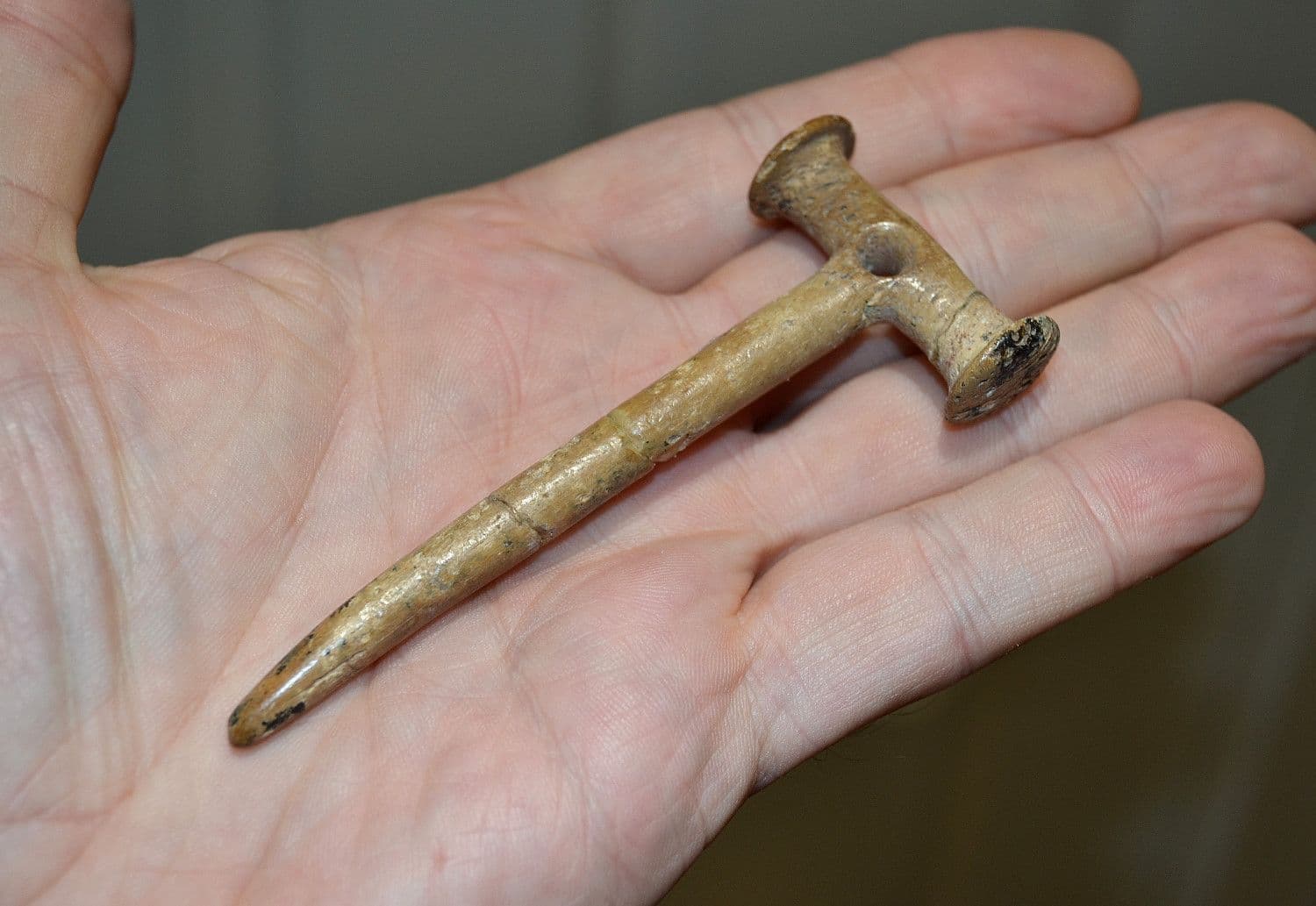 An extremely rare Neolithic ornately carved bone cloak pin with ...