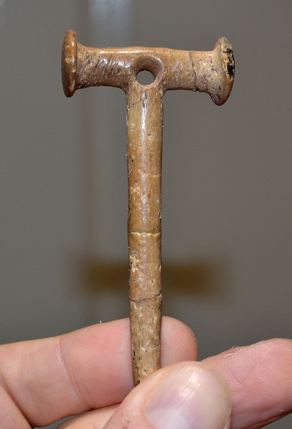 An extremely rare Neolithic ornately carved bone cloak pin with ...