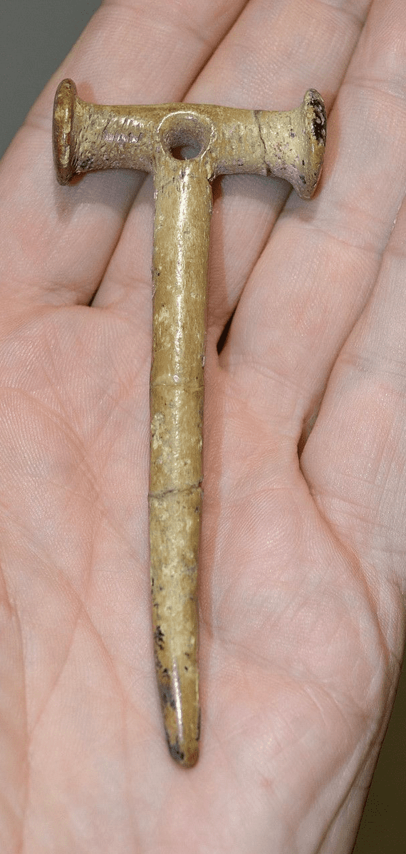 An extremely rare Neolithic ornately carved bone cloak pin with ...