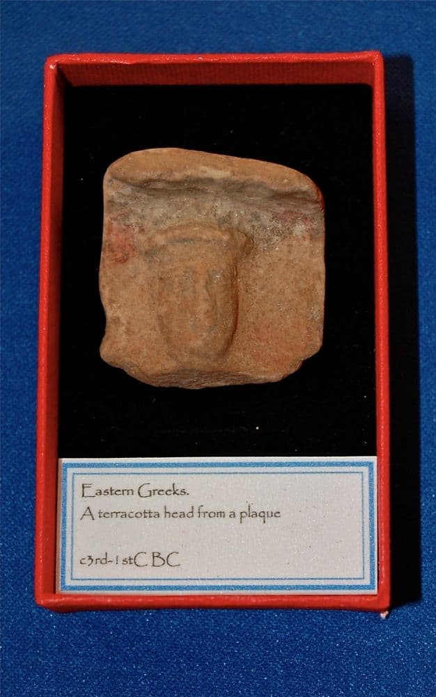 The head segment from an Ancient Greek terracotta votive plaque of the ...