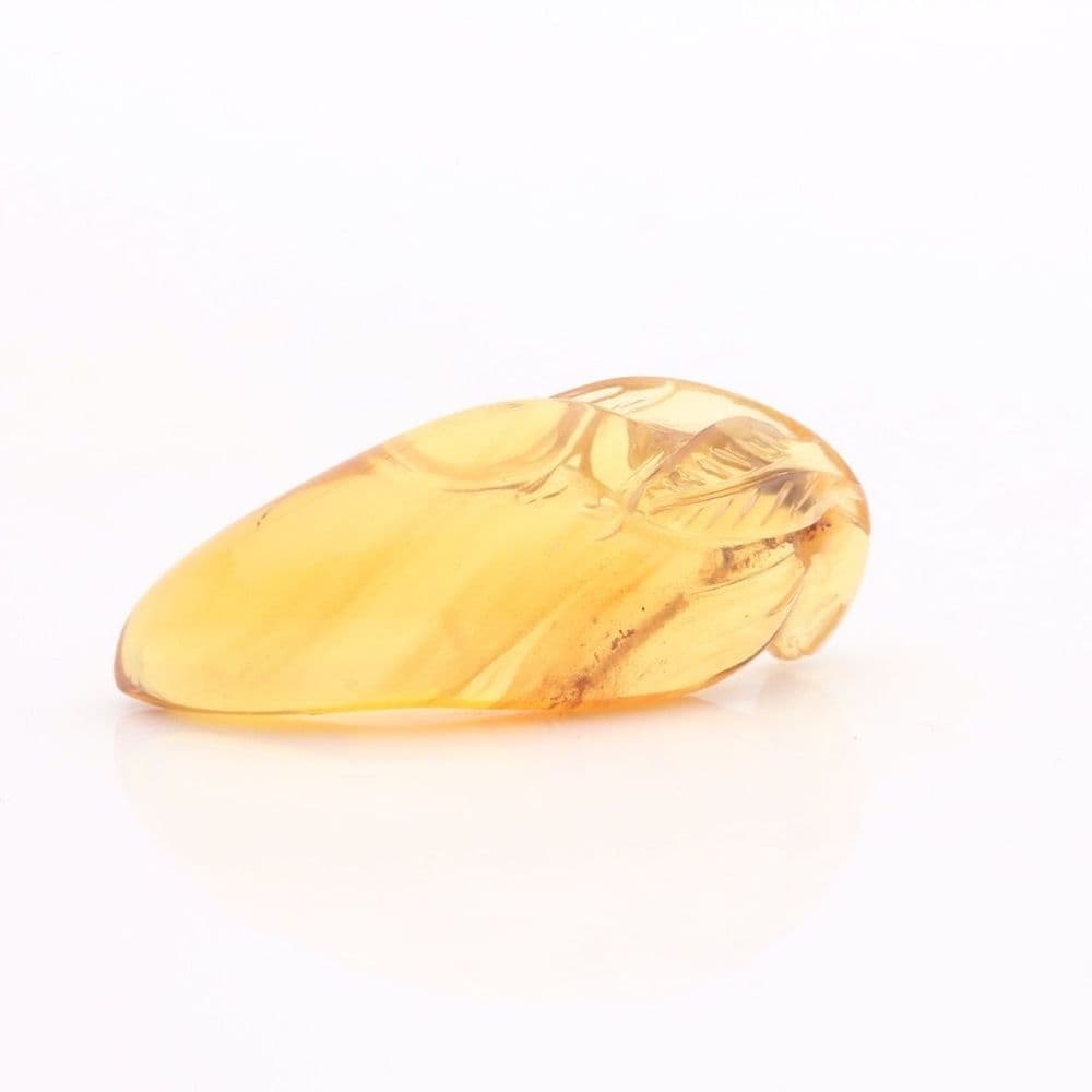 Green Man carved in Amber