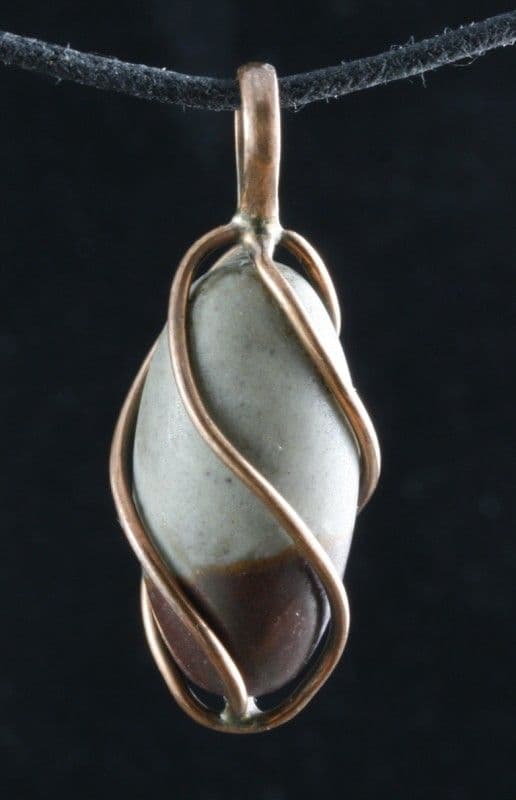 Shiva Lingam Pendant in copper wire cage