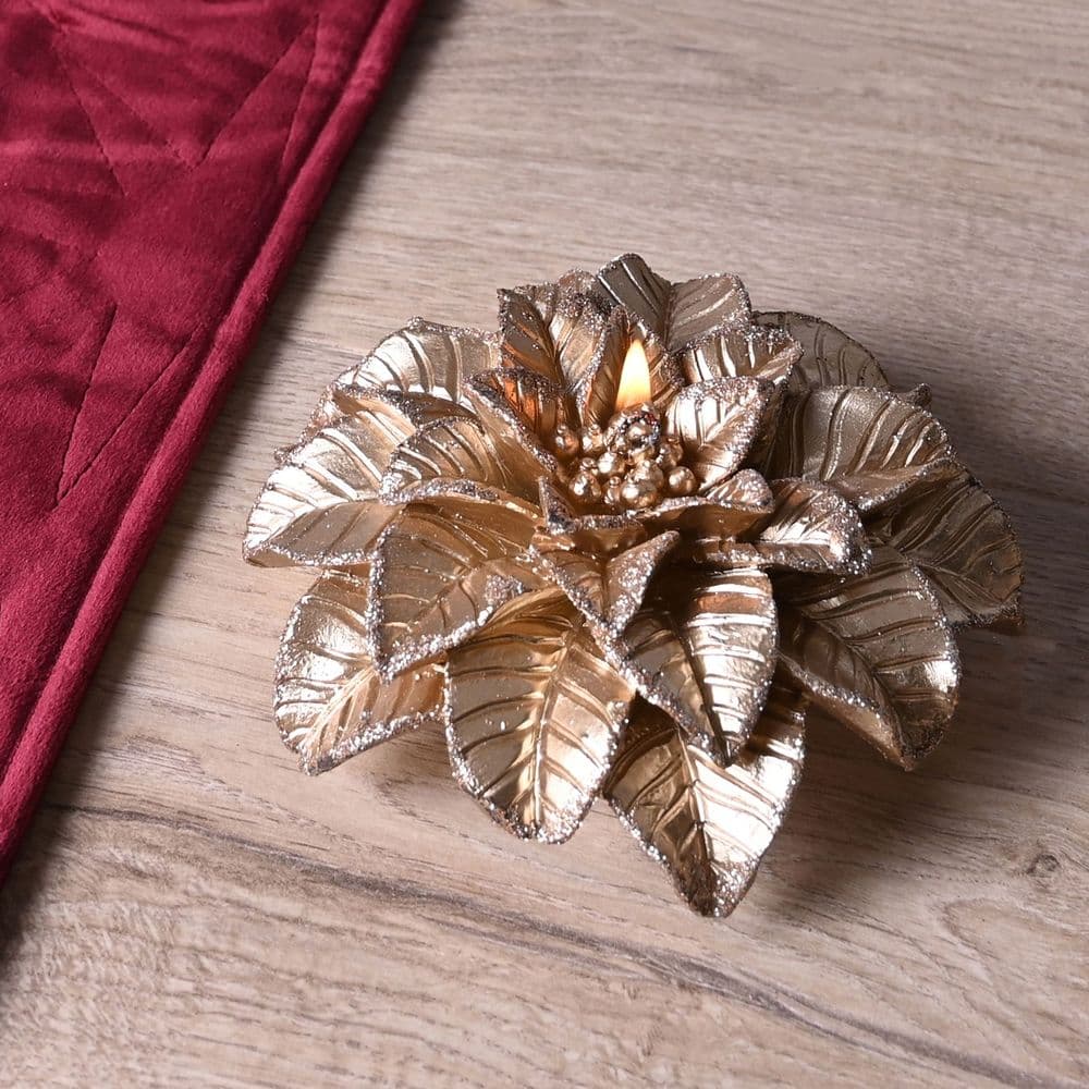 Golden poinsetta Shaped Christmas statement Candle - Christmas centre ...