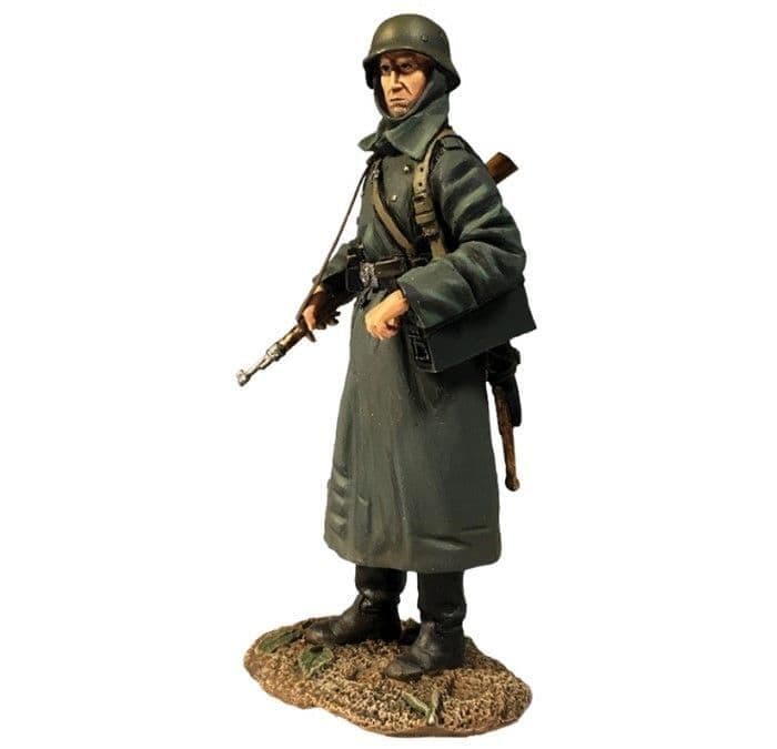 WB25077 - German Volksgrenadier Standing with Ammo Can in Greatcoat